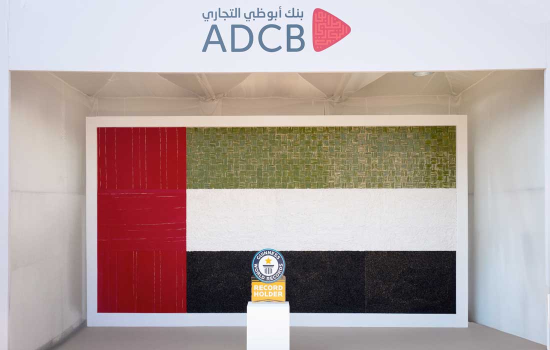 ADCB sets biodegradable UAE flag record