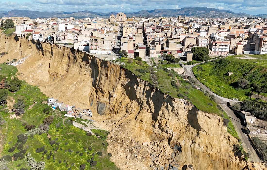 Sicily landslide storm damage leaves town perched on cliffs